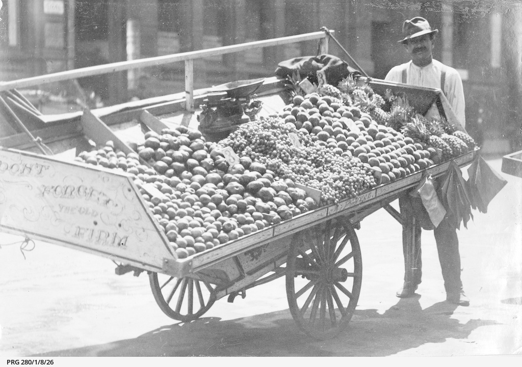 A vendor with his fruit and vegetable barrow stall • Photograph • State ...