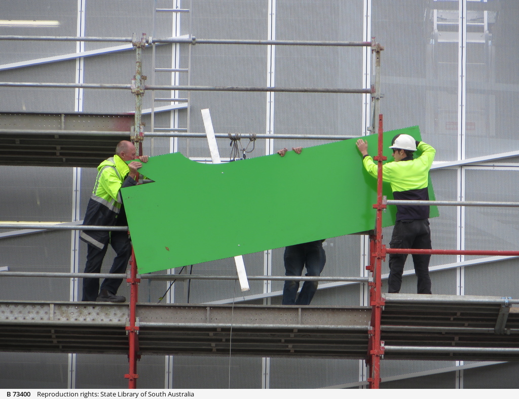 Men installing sign • Photograph • State Library of South Australia