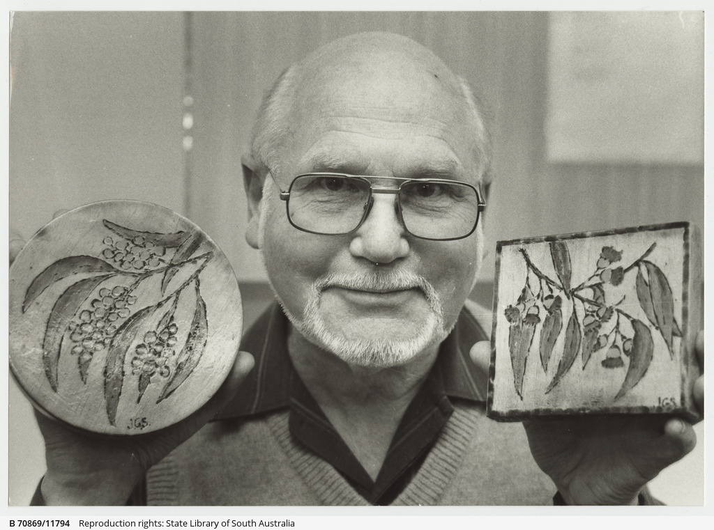 John Scriven with his placemats featuring the art of woodburning. 10th ...
