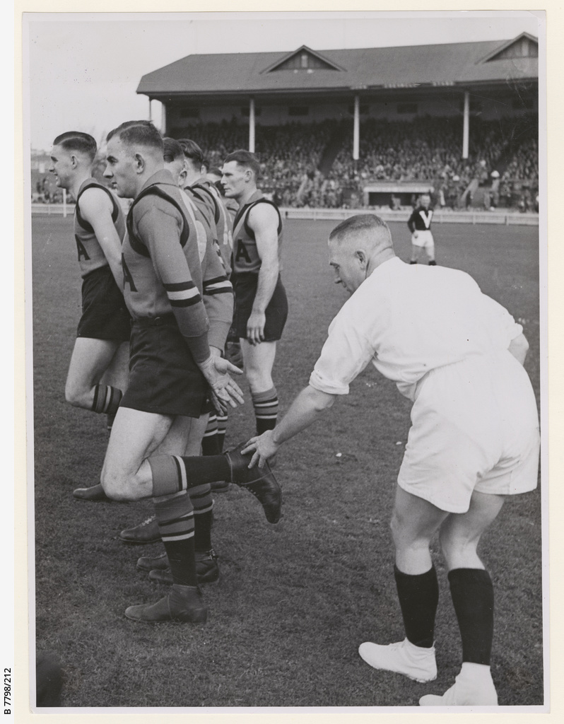 Umpire inspecting players boots before a South Australia vs Victoria ...