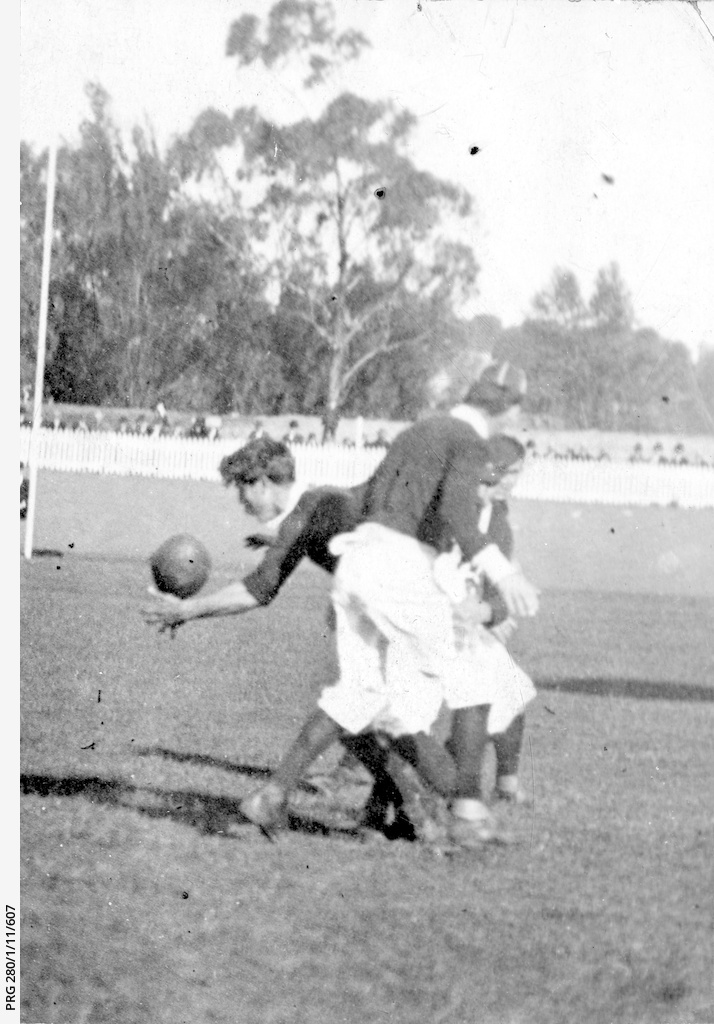 Football players trying to capture the ball • Photograph • State ...