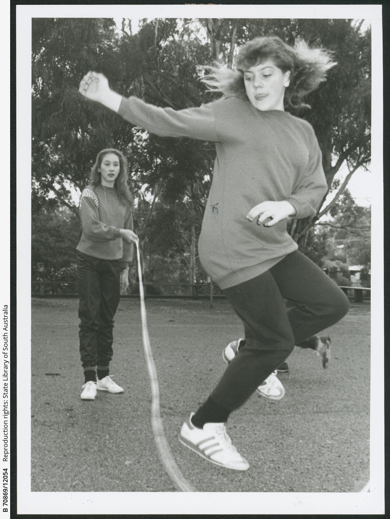 Trish, 12, skips while Cherie, 12, swings the rope during practise for ...