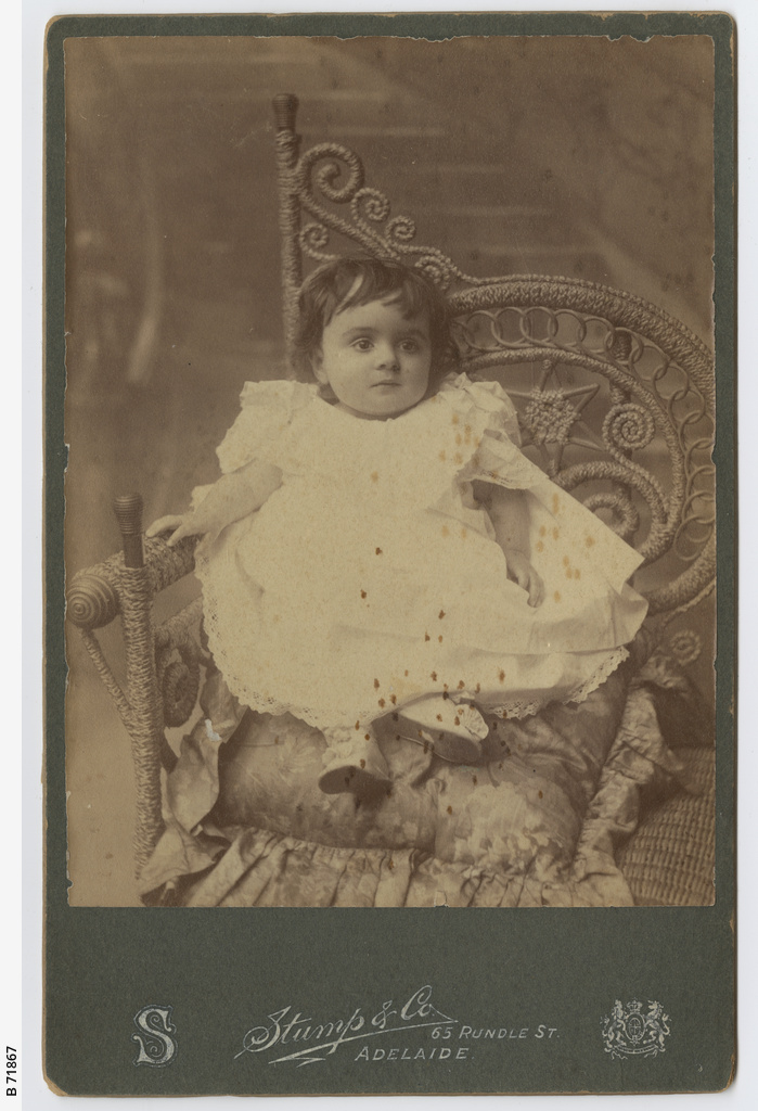 Young child sitting in cane chair • Photograph • State Library of South ...