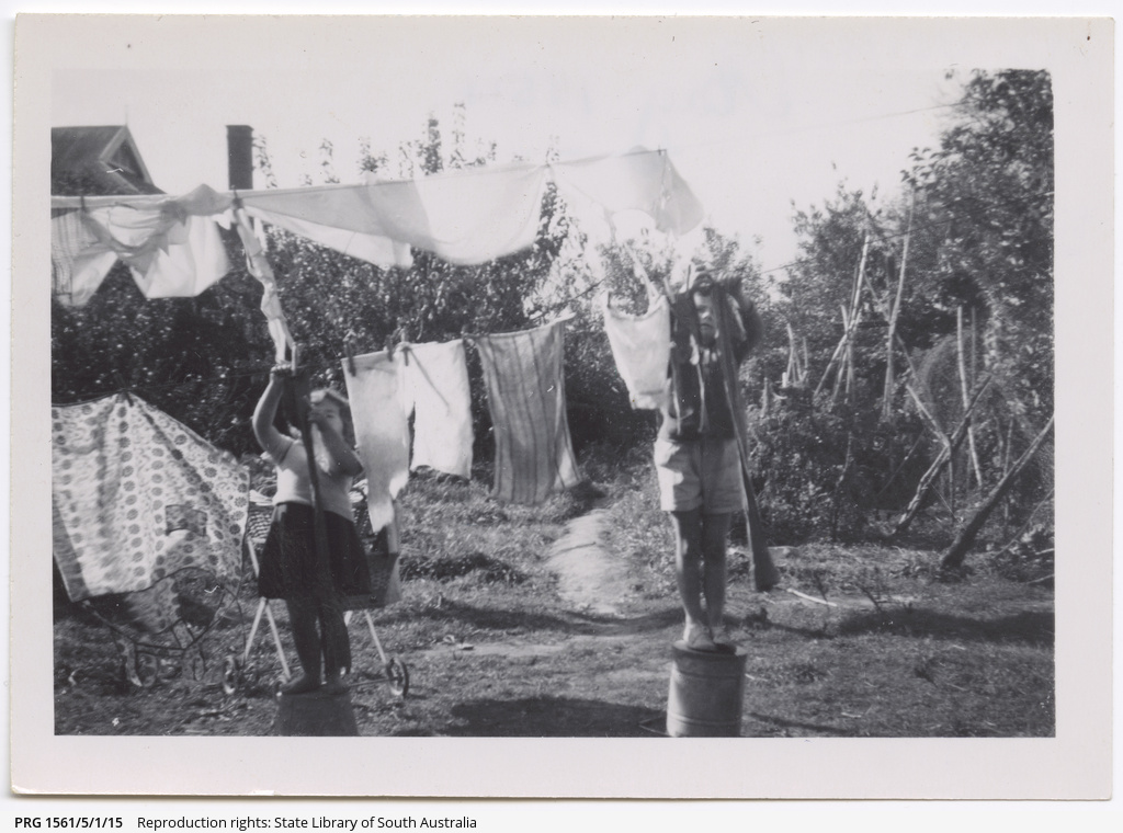 Boy and girl hanging washing • Photograph • State Library of South ...
