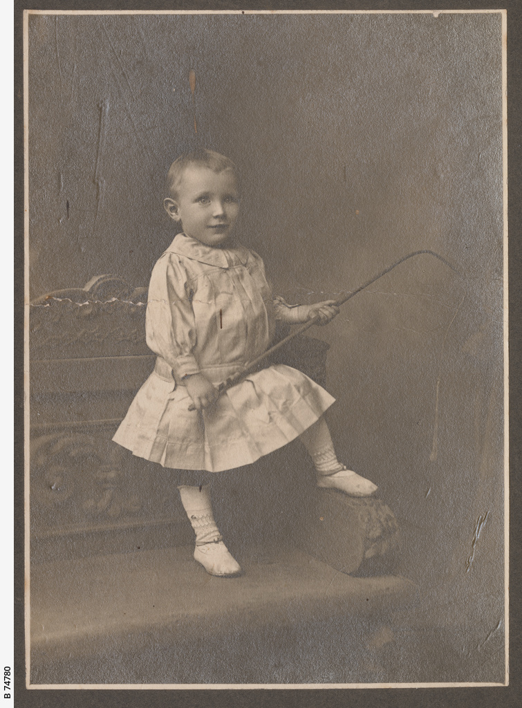 Child holding a whip • Photograph • State Library of South Australia