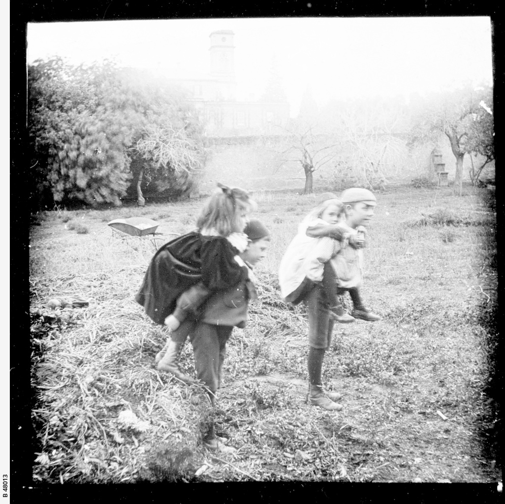 Children playing piggyback • Photograph • State Library of South Australia