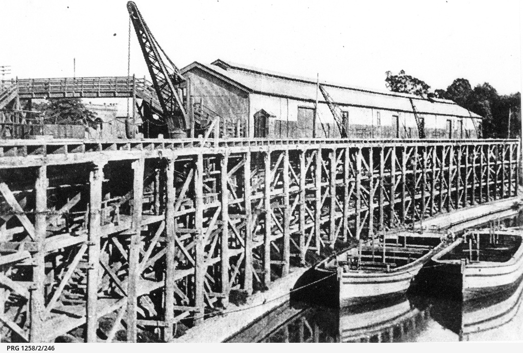 Echuca Wharf showing its structure, with two barges tied up ...