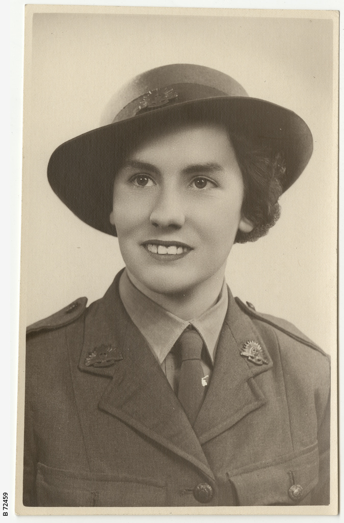 Young woman in Army uniform • Photograph • State Library of South Australia